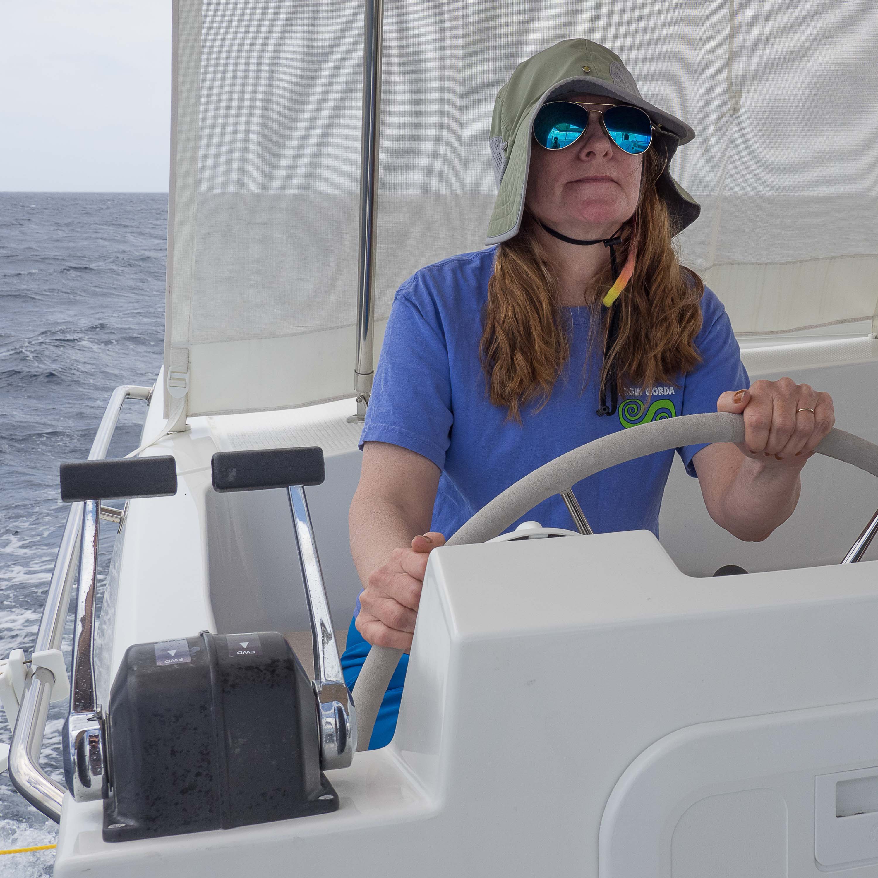 Woman Behind The Wheel – Sailing Sea Sea